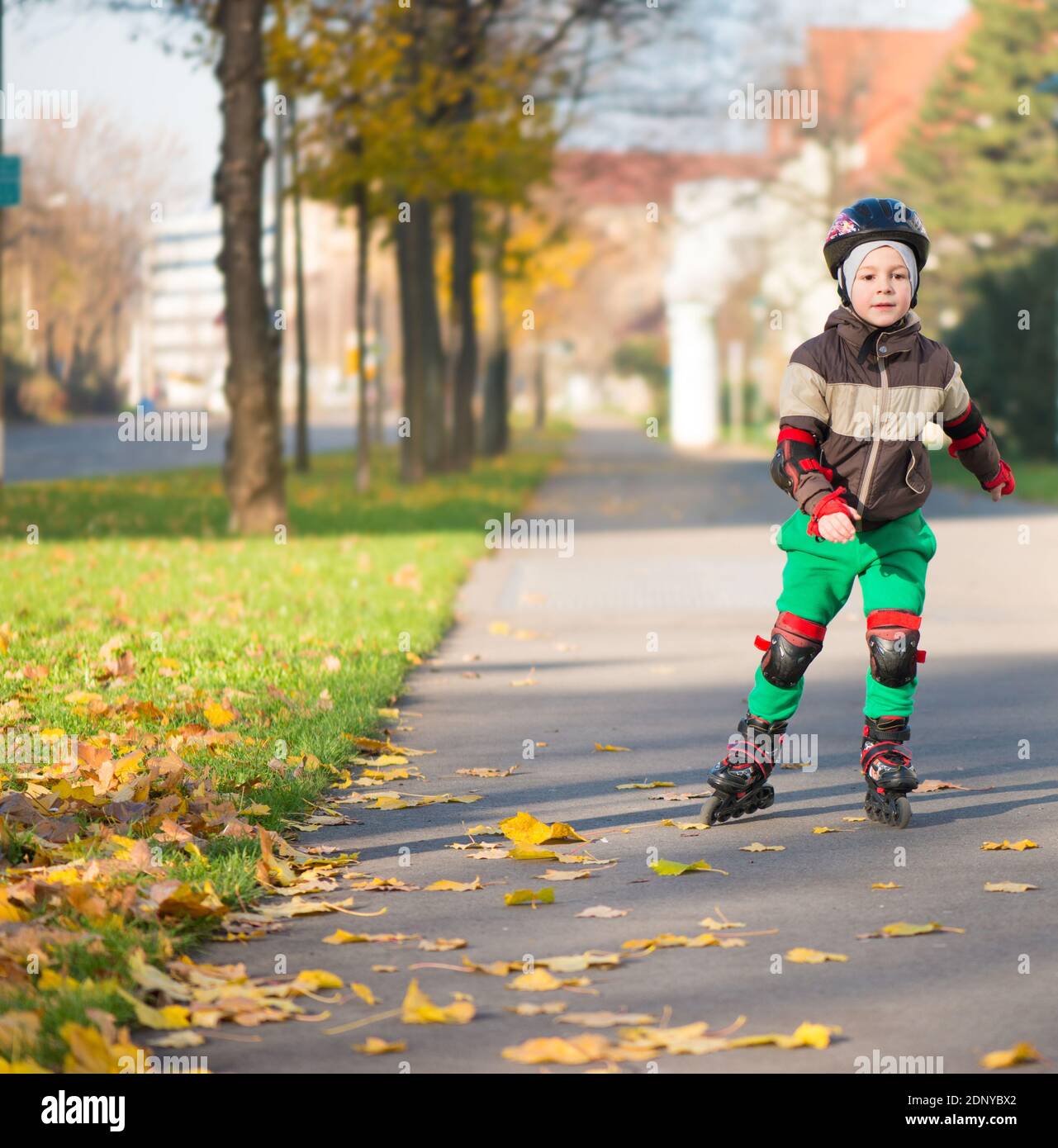 Boy inline skating outdoors hi-res stock photography and images - Alamy