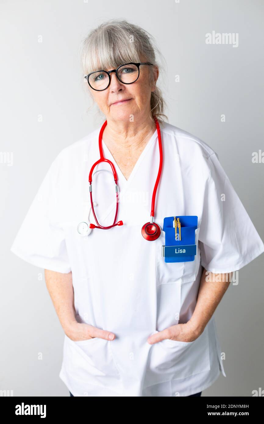Doctor looking at camera Stock Photo - Alamy