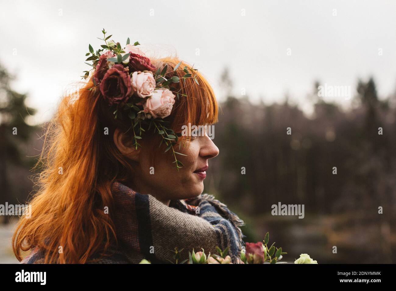 Red-haired woman with flowers in her hair Stock Photo - Alamy