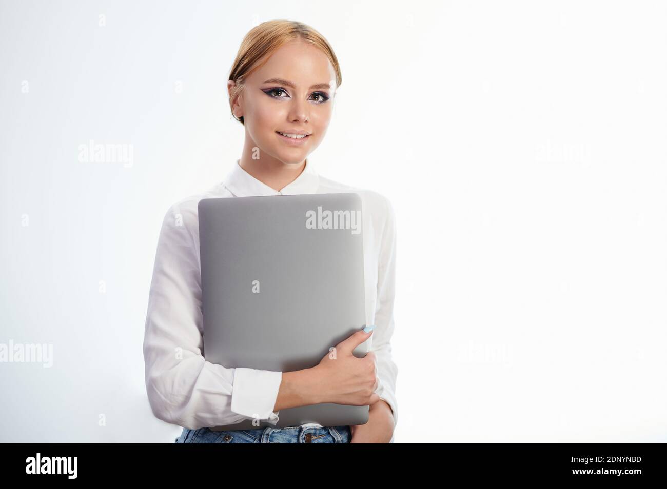 Young girl hold laptop isolated on white studio background Stock Photo ...