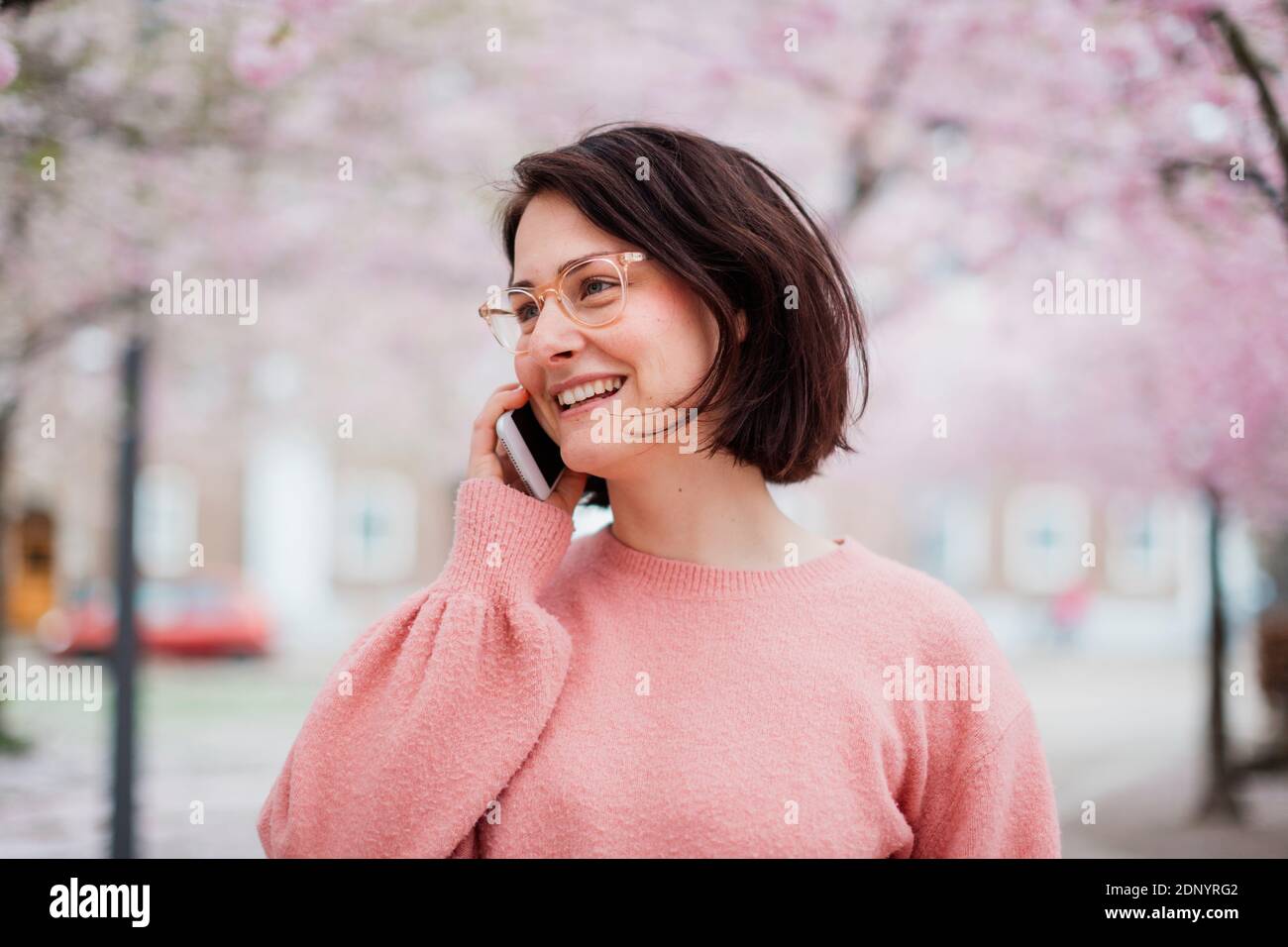 Smiling positive woman talking via hi-res stock photography and images ...