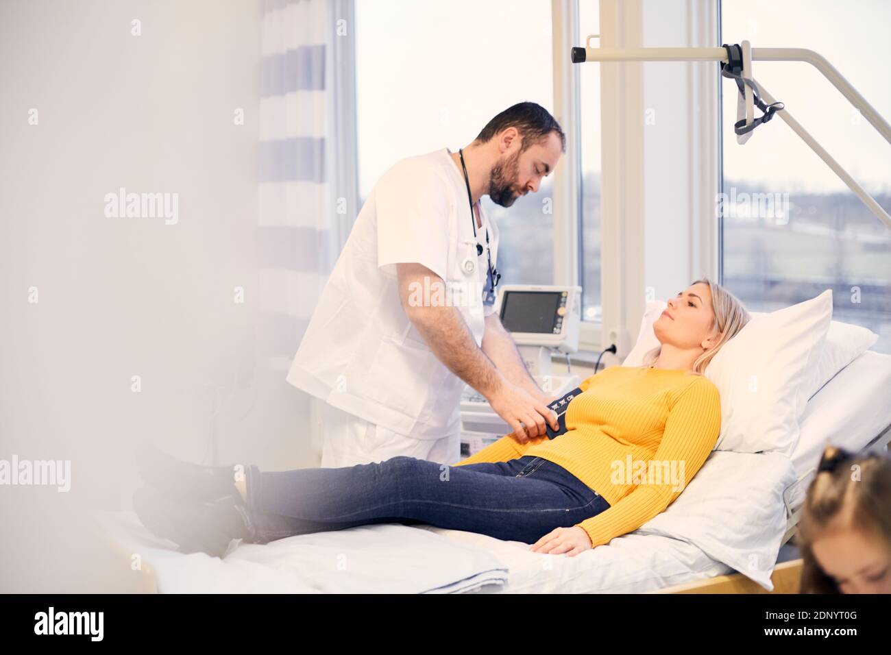 Doctor examining woman Stock Photo - Alamy
