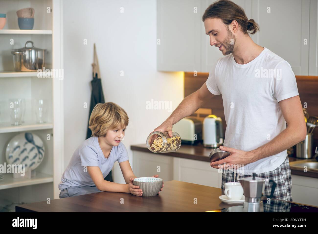 Man making breakfast cereal hi-res stock photography and images - Alamy