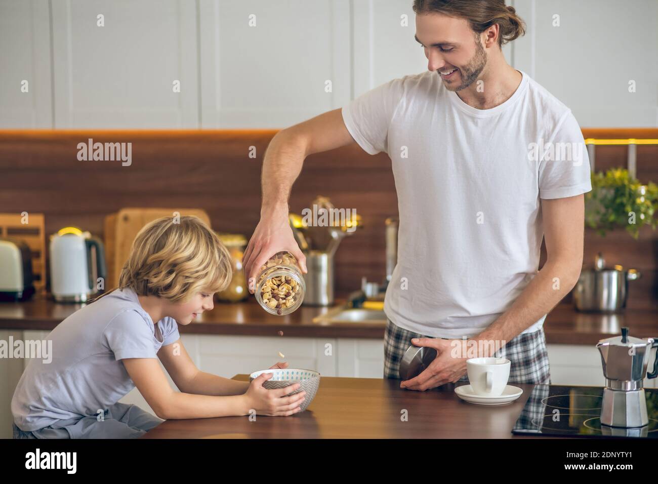 Man making breakfast cereal hi-res stock photography and images - Alamy
