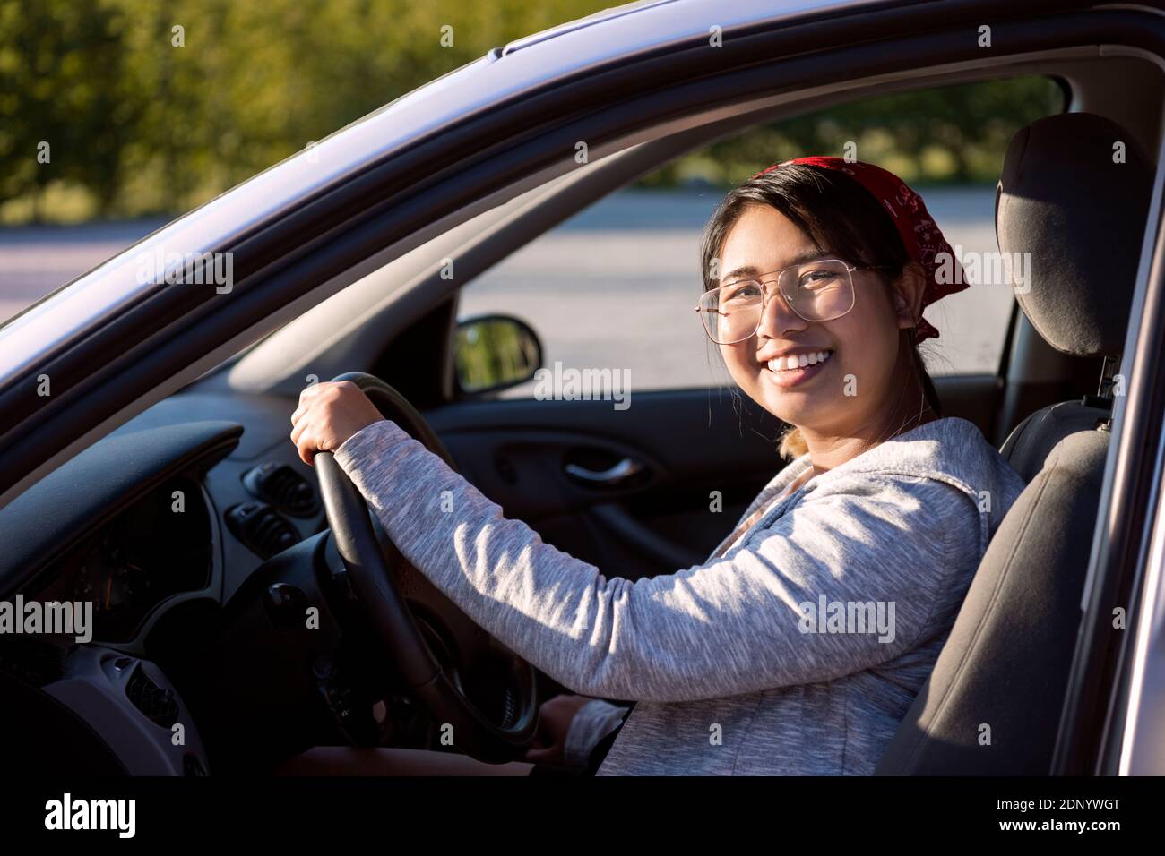 Asian woman driving car hi-res stock photography and images - Alamy