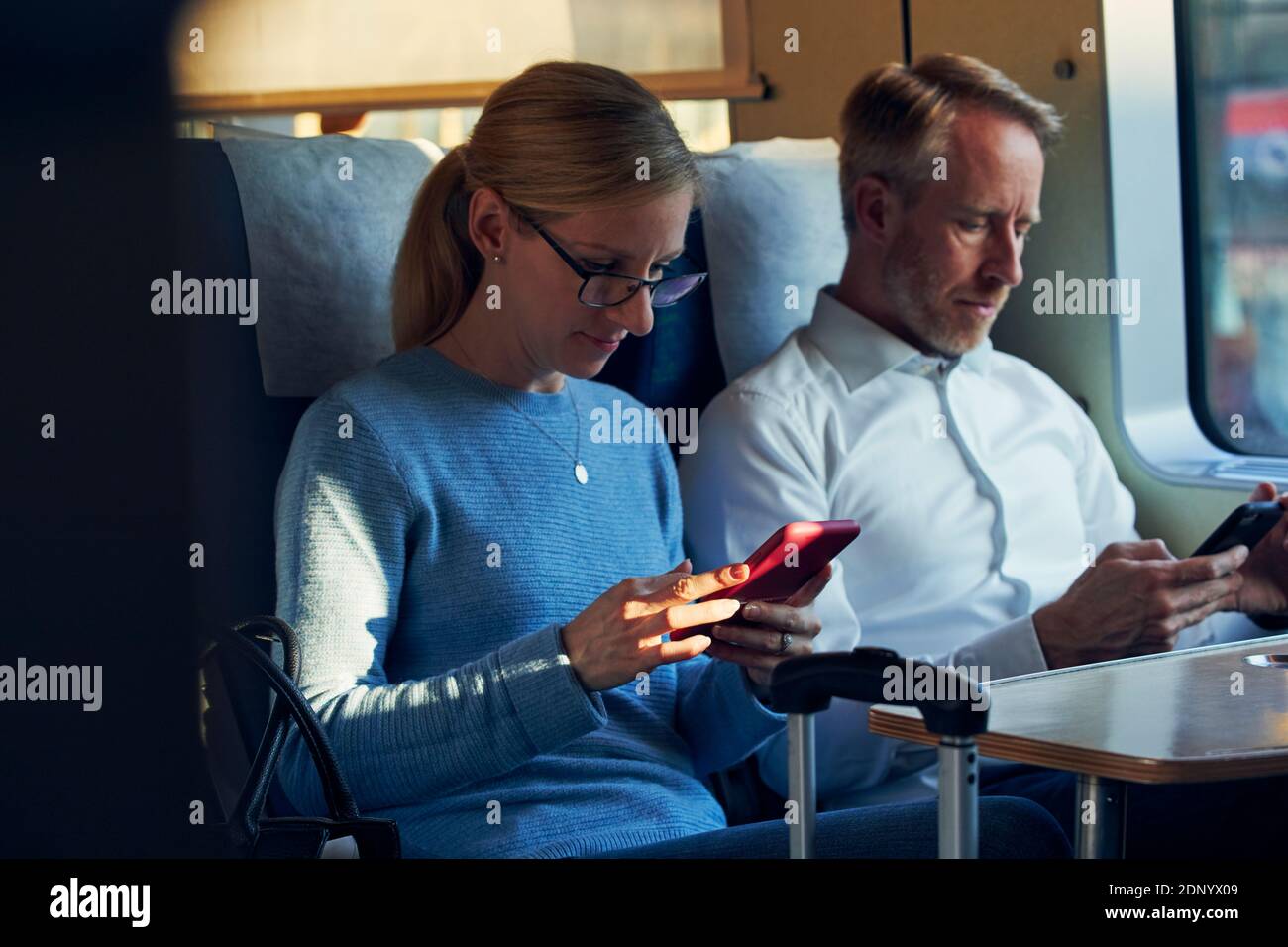 Couple in train carriage Stock Photo - Alamy