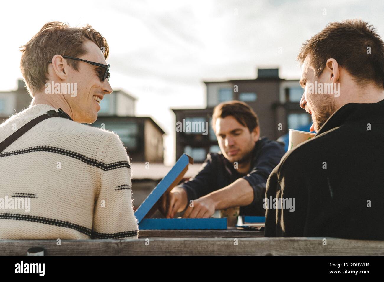 Smiling friends talking Stock Photo - Alamy