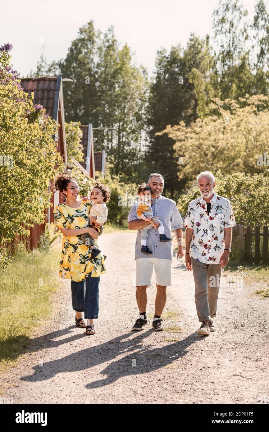 Three generation family walking together Stock Photo - Alamy