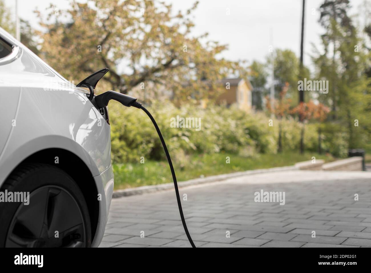Electric car on charge Stock Photo - Alamy