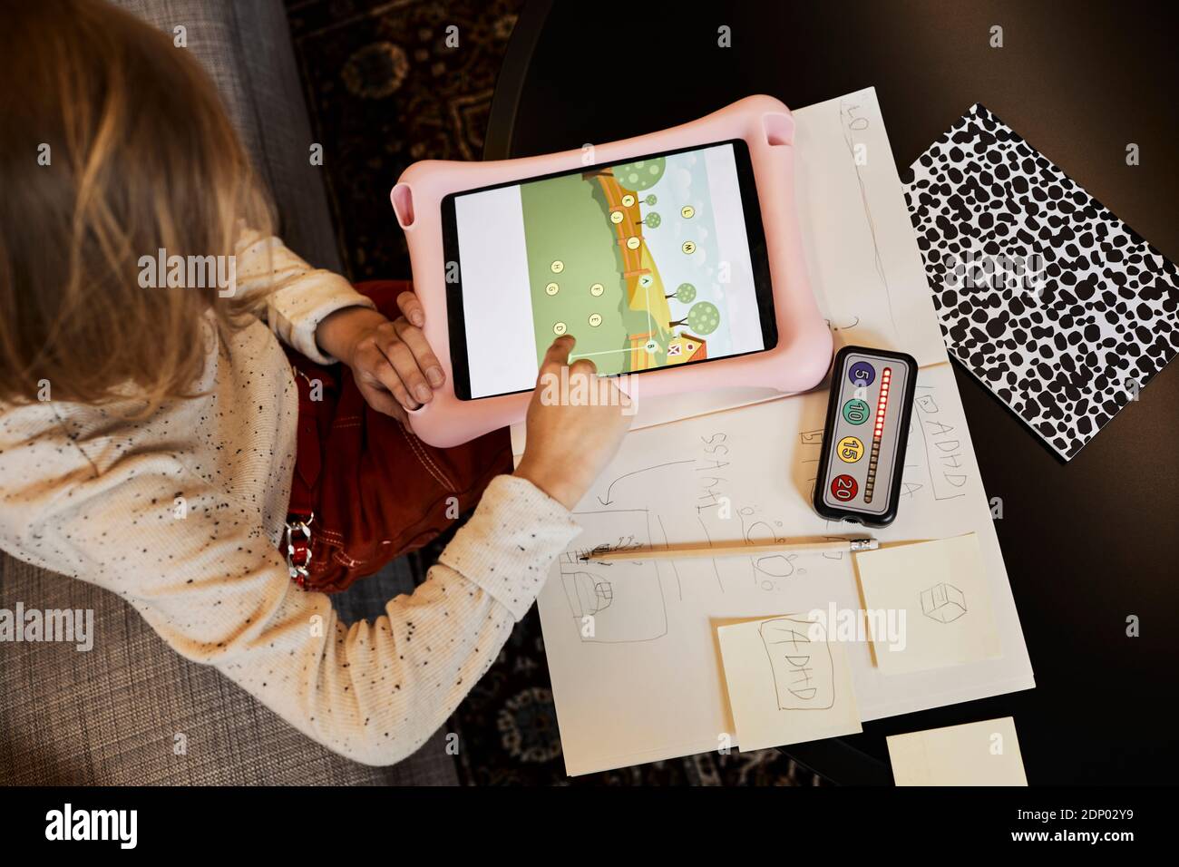 Girl at occupational therapy session using digital tablet Stock Photo ...