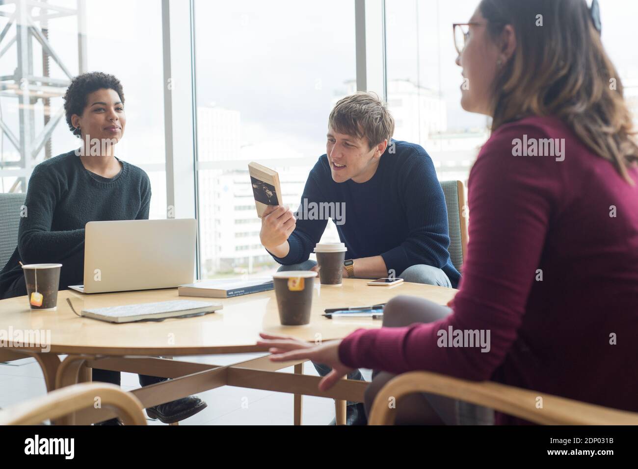 People sitting in library Stock Photo - Alamy