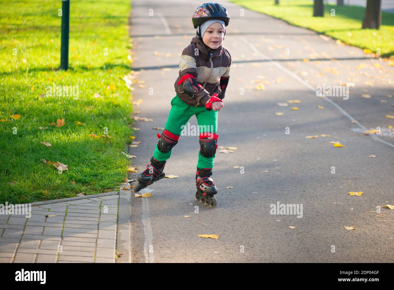 Boy inline skating outdoors hi-res stock photography and images - Alamy