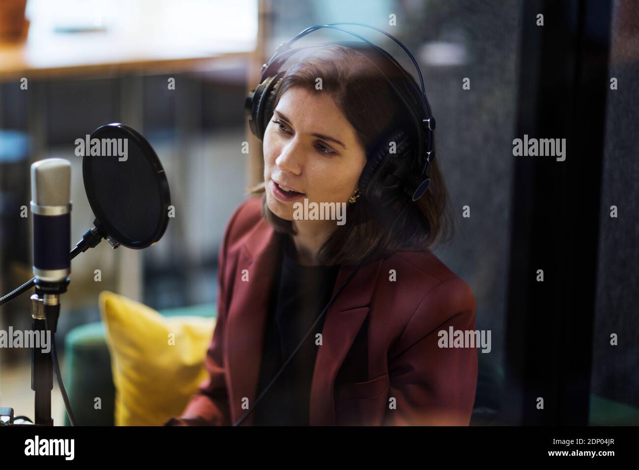Woman broadcasting from radio station Stock Photo - Alamy