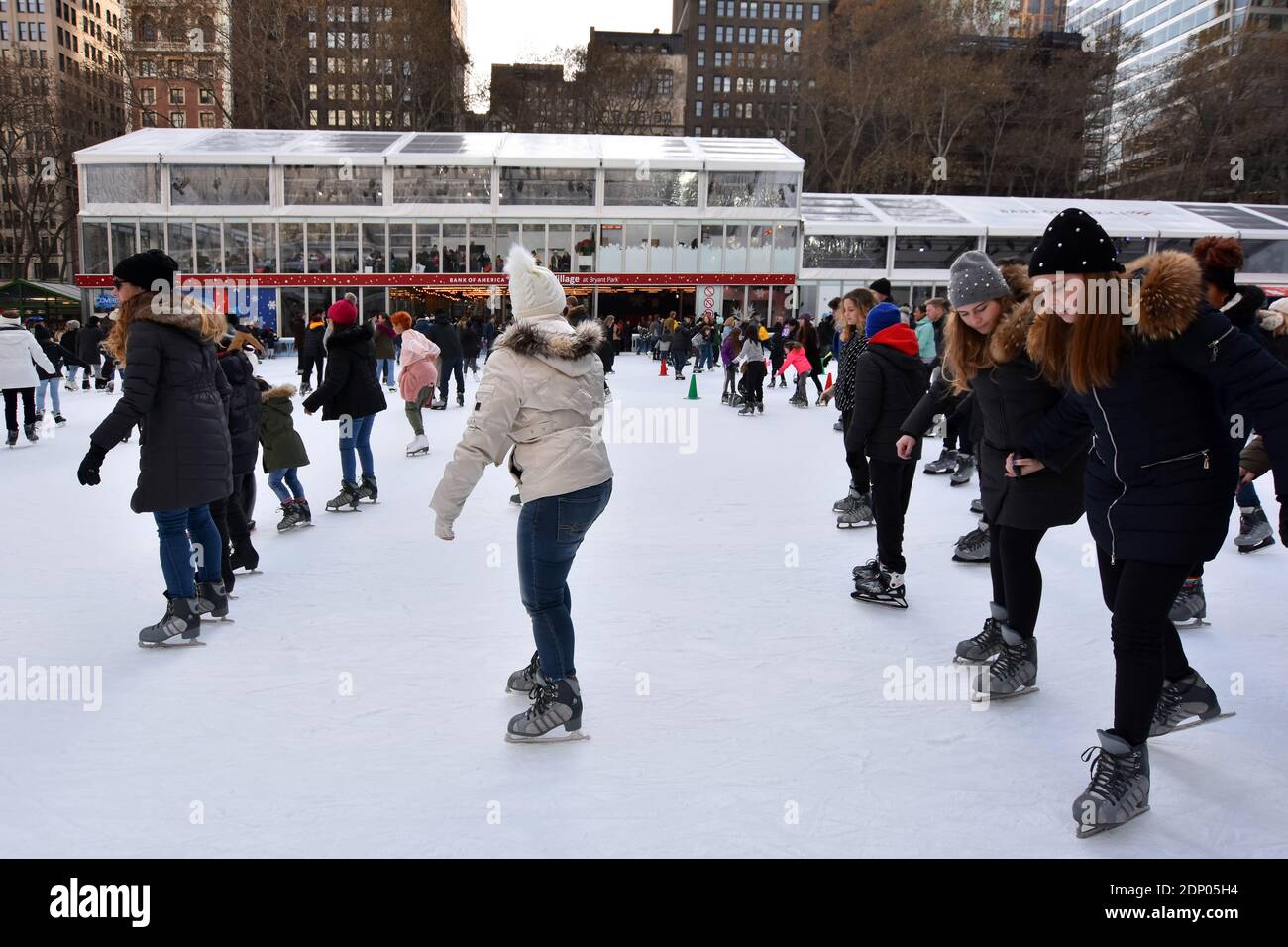 Crowd of people on the Ice Skating Rink at Bryant Park Winter Village ...