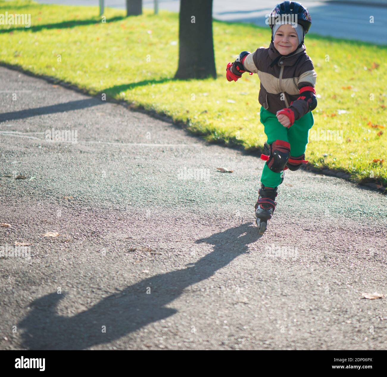 Boy inline skating outdoors hi-res stock photography and images - Alamy