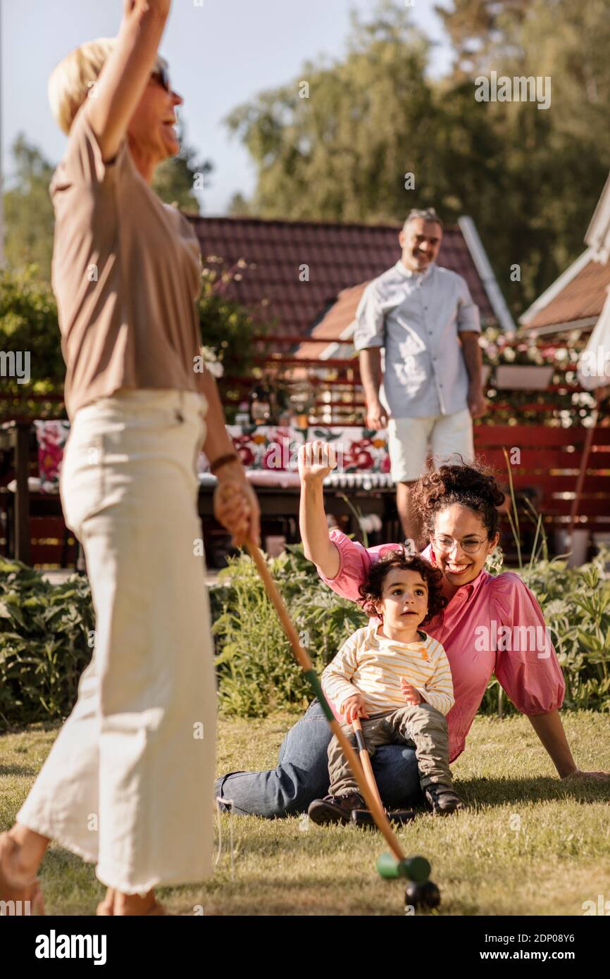 Happy family in garden Stock Photo - Alamy