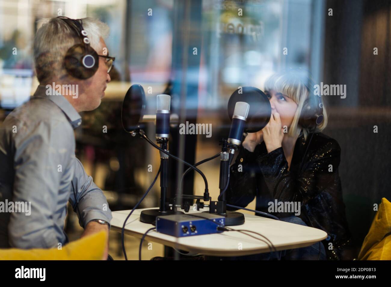 People broadcasting from radio station Stock Photo - Alamy
