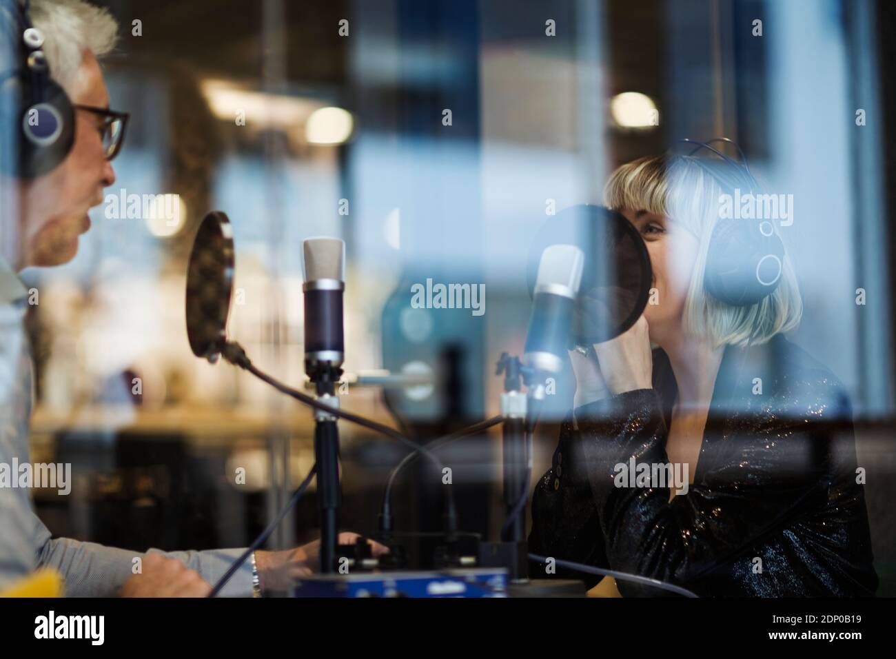 People broadcasting from radio station Stock Photo - Alamy