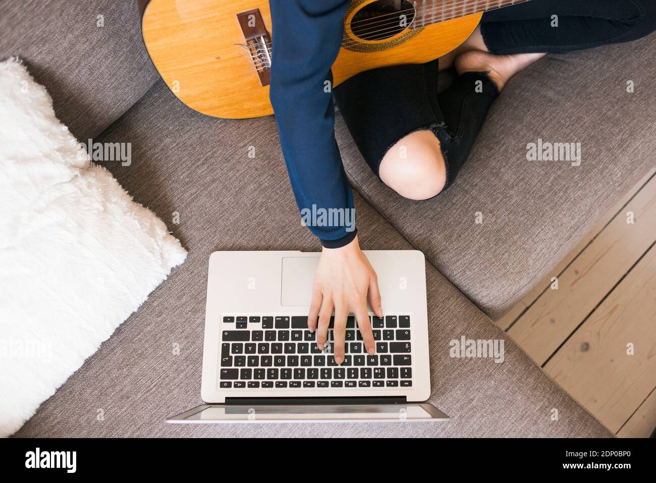 Womans hand using laptop Stock Photo - Alamy