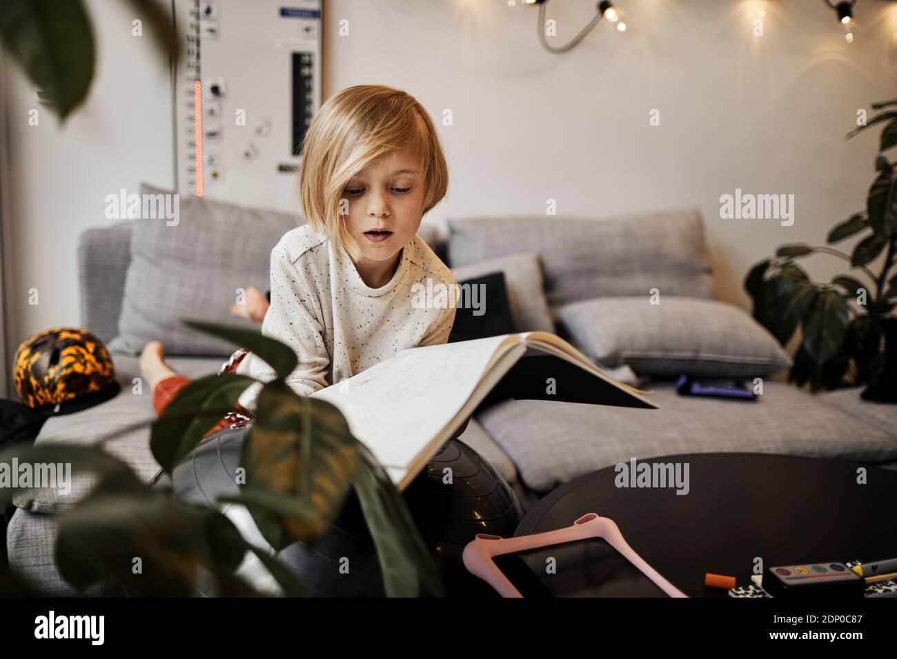 Girl holding open notebook Stock Photo - Alamy