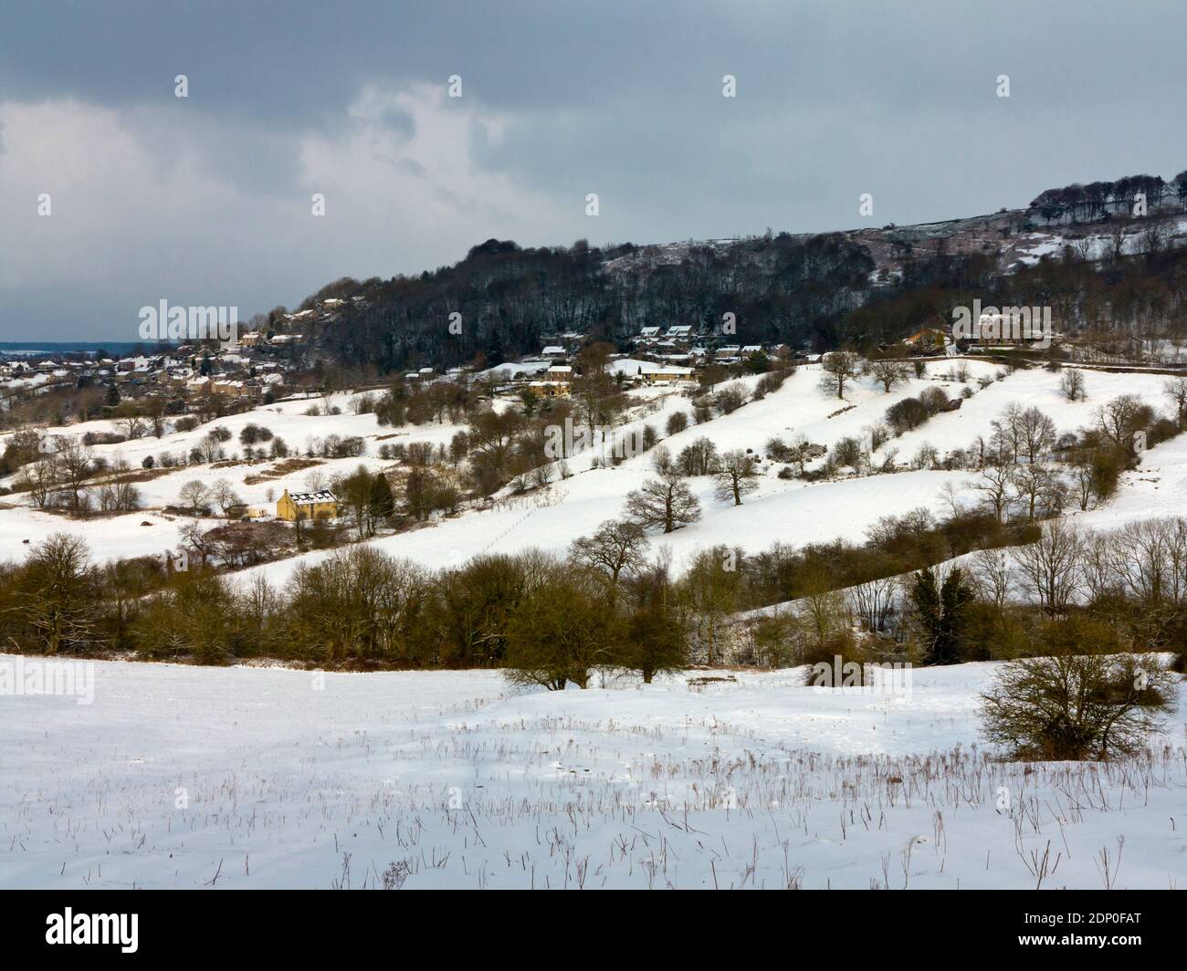 Snow covered landscape with trees at Starkholmes near Matlock Bath in ...