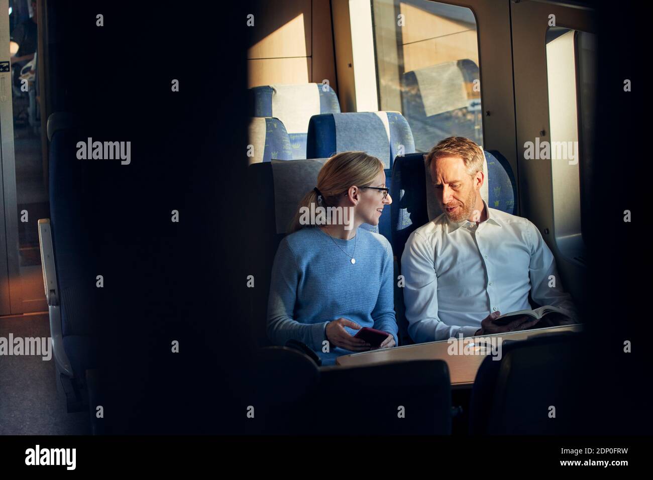 Two people sitting in train hi-res stock photography and images - Alamy