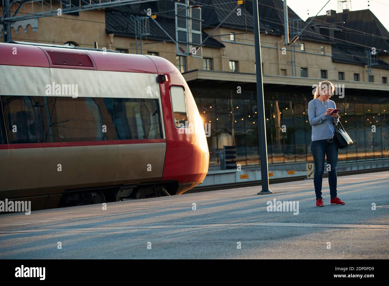 Woman standing train hi-res stock photography and images - Alamy