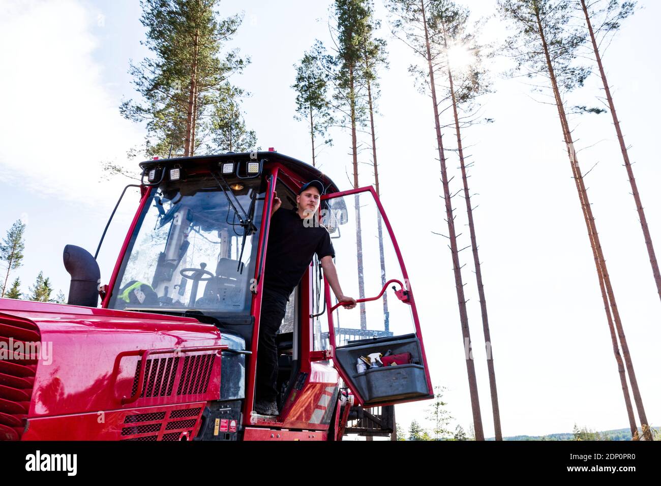 Man in tractor Stock Photo - Alamy