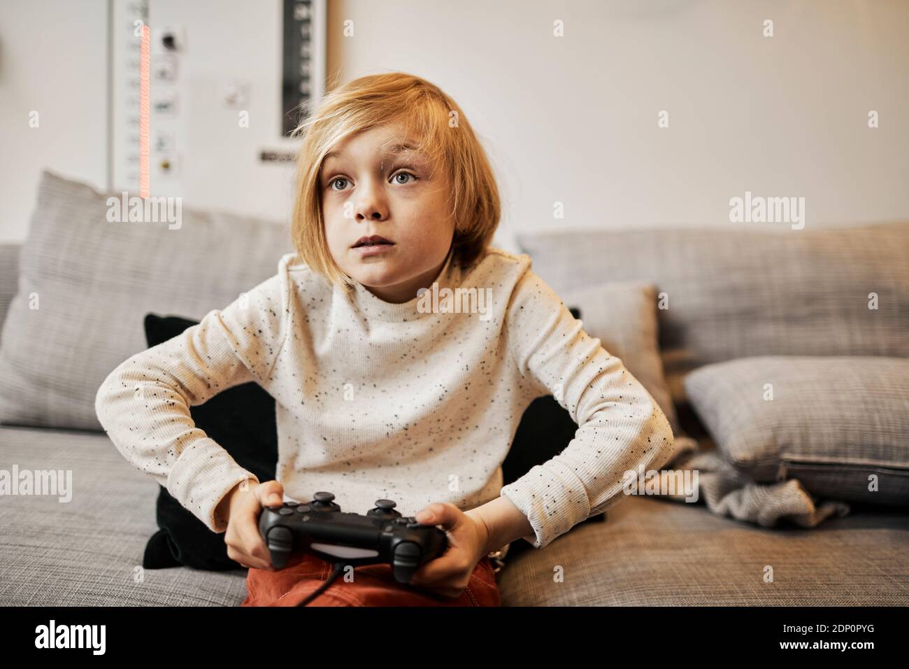 Girl playing video game Stock Photo - Alamy