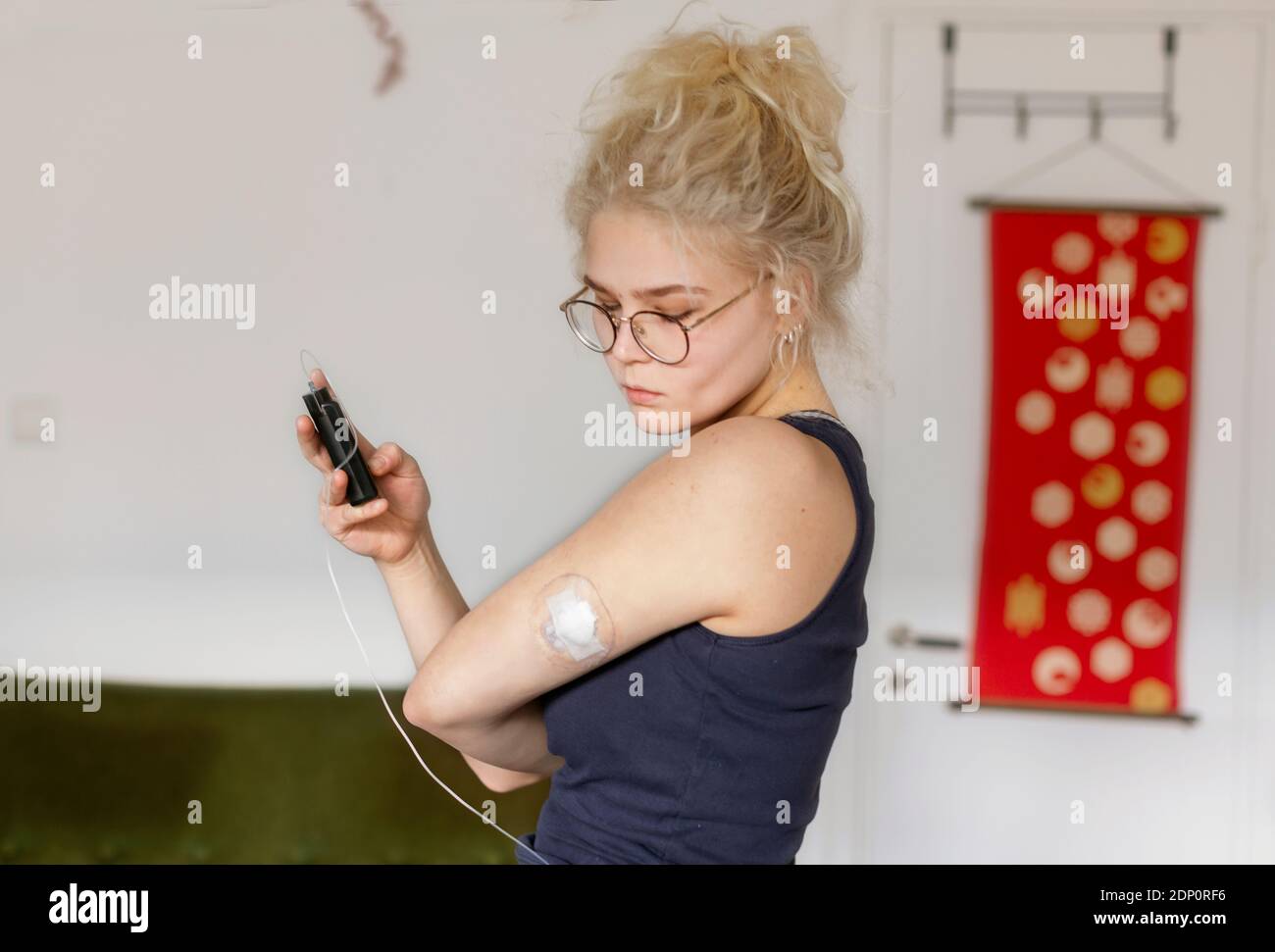 Young woman using insulin pump Stock Photo - Alamy