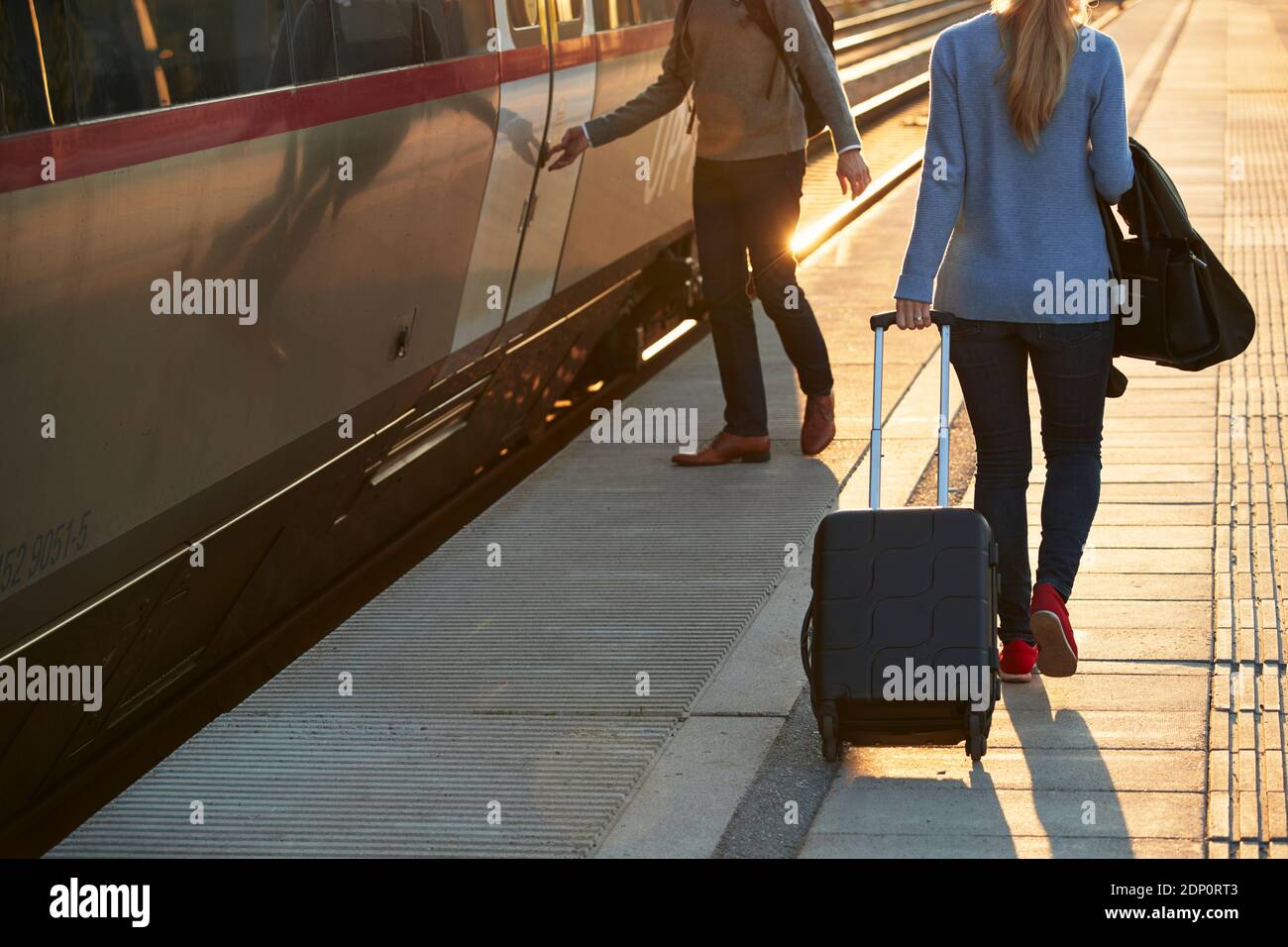 People entering train at station Stock Photo - Alamy
