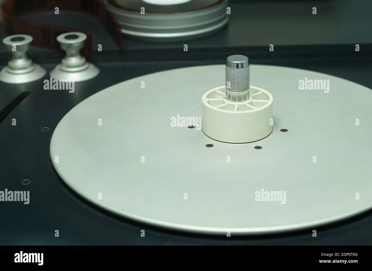 Close-up a take-up and feed 35mm film reel with core roller of the ...