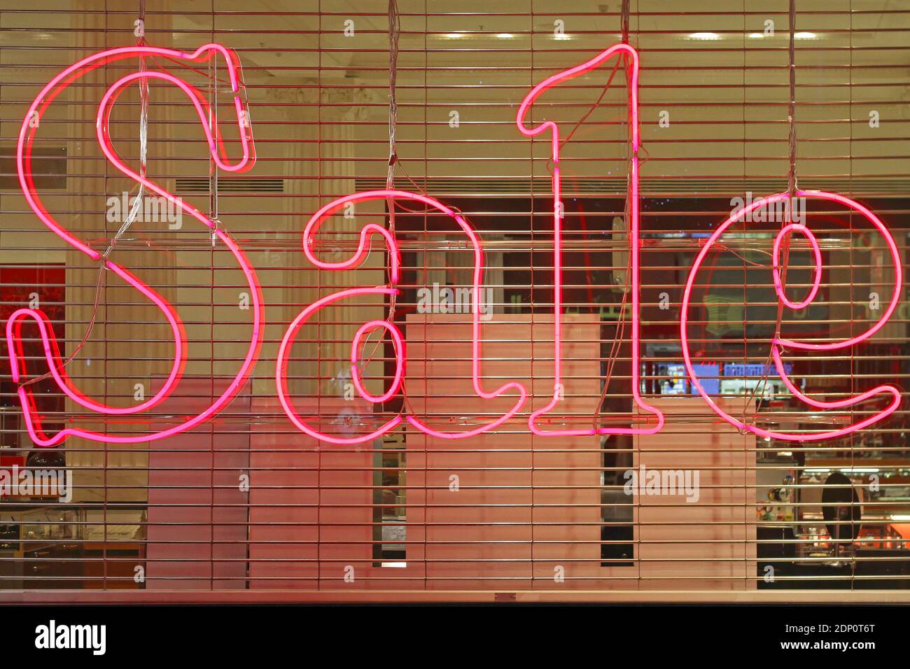 Pink Sale Advertisment Neon Sign in Window Stock Photo - Alamy