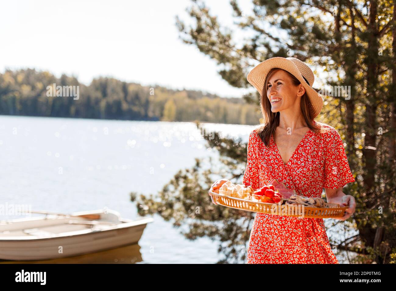 Woman carrying tray hi-res stock photography and images - Alamy