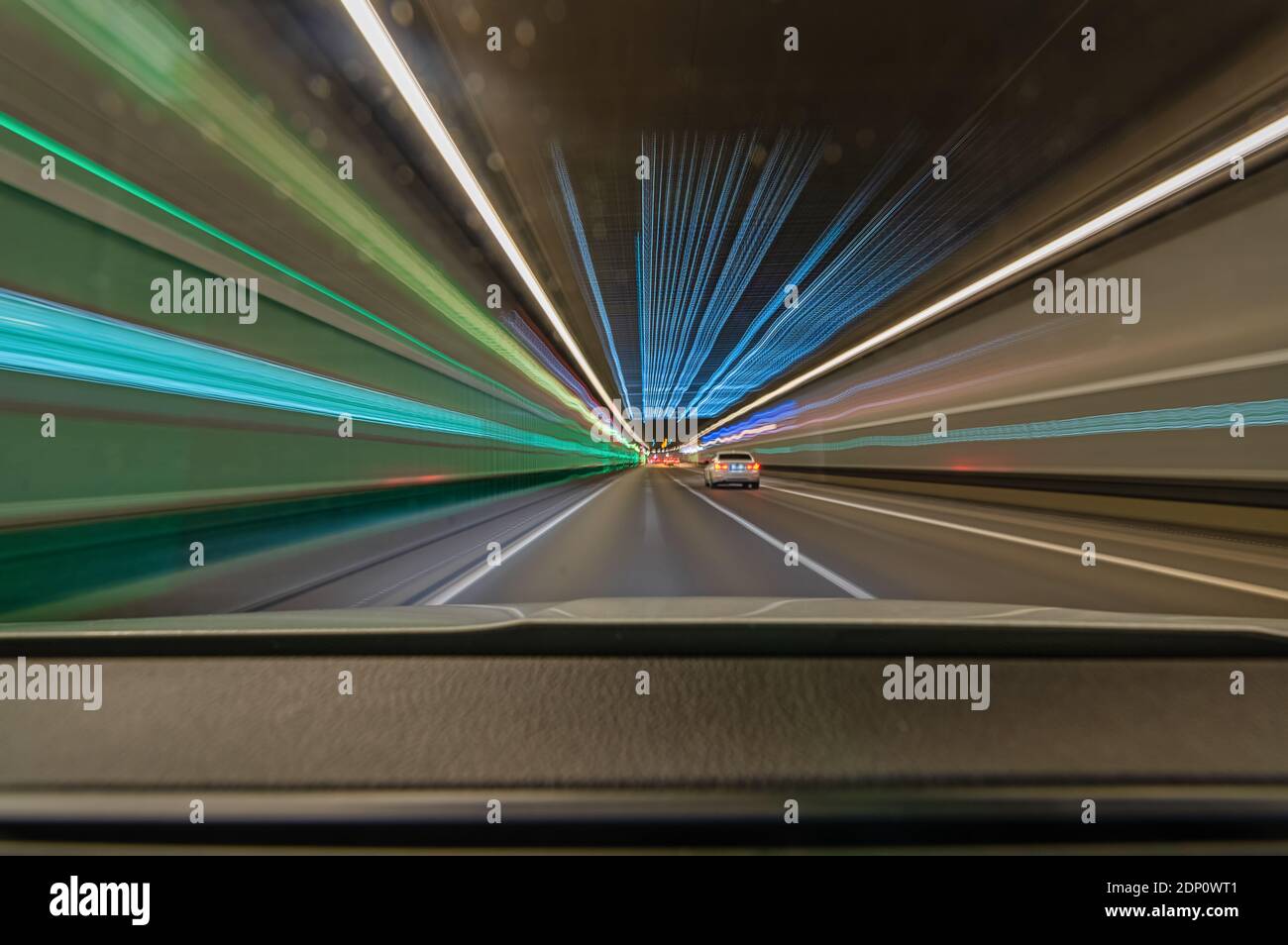 Speed driving car with light trails in a tunnel, fast accelerated ...