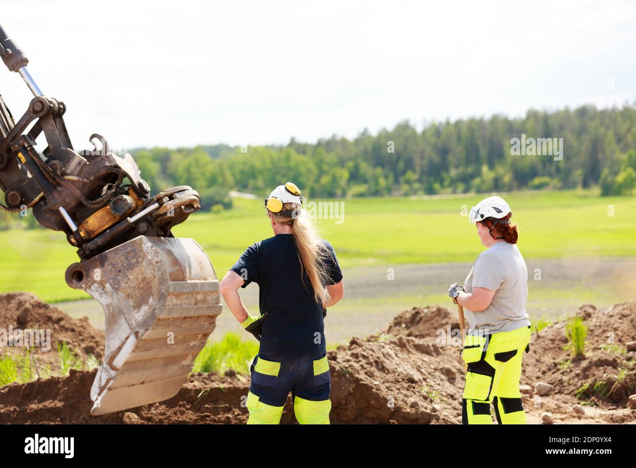 Two workers standing excavator hi-res stock photography and images - Alamy