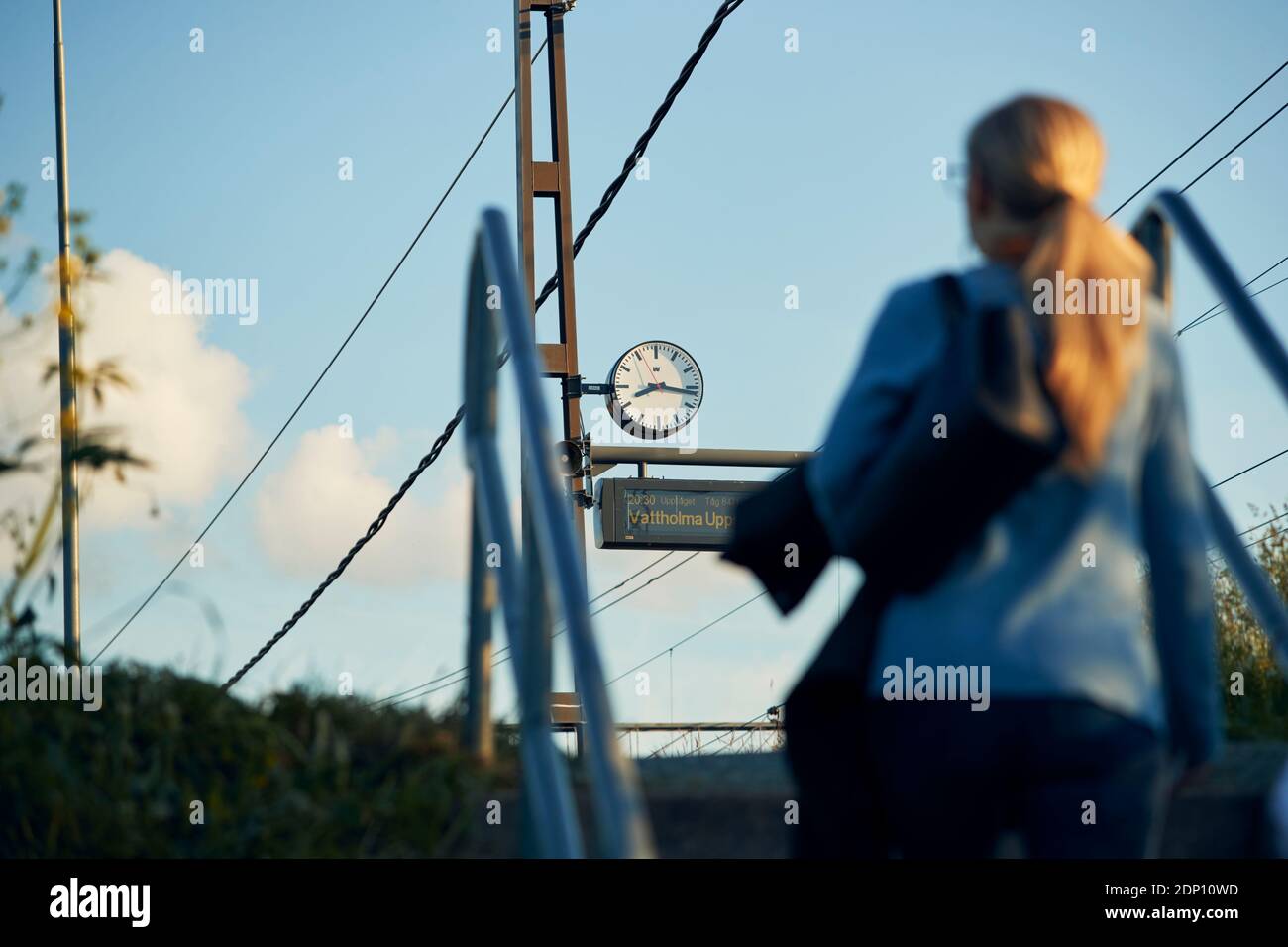 Clock on train station platform Stock Photo - Alamy