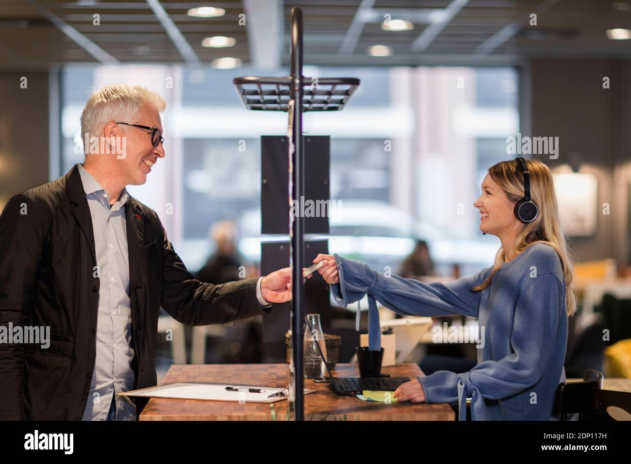 Smiling people in reception Stock Photo - Alamy