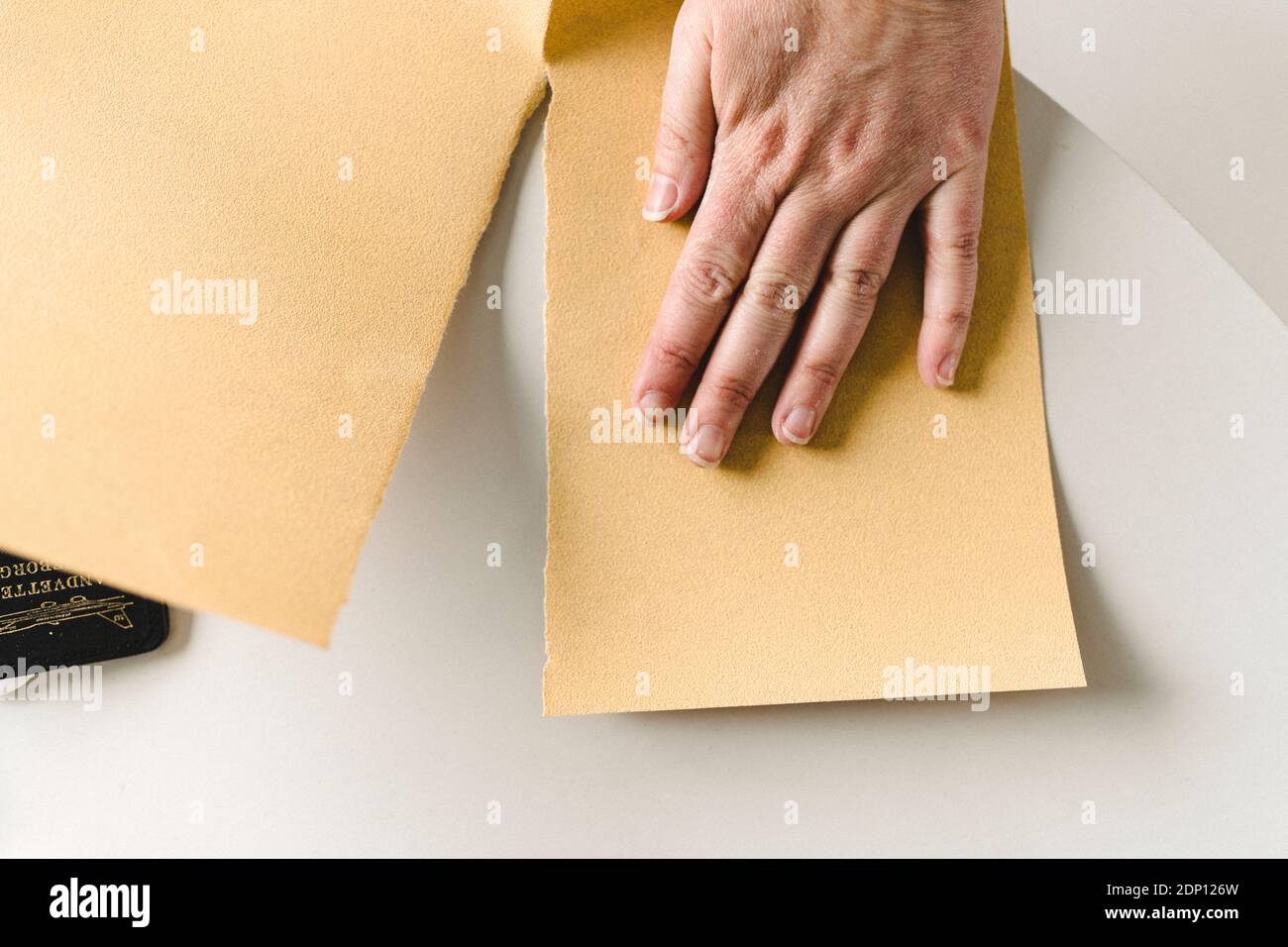 Hand with sandpaper hi-res stock photography and images - Alamy
