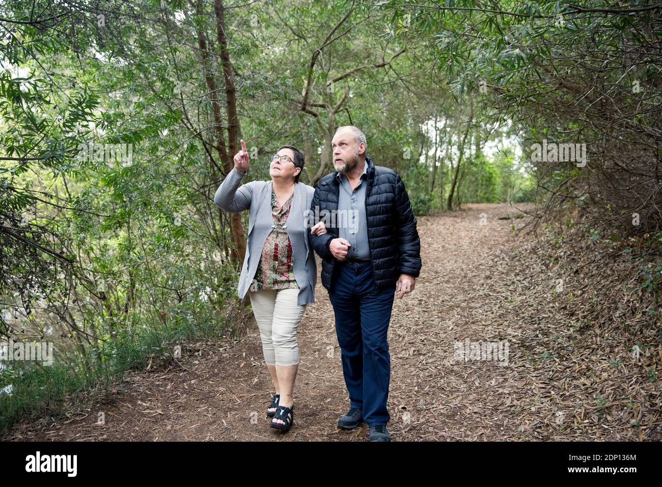 Couple walking together Stock Photo - Alamy