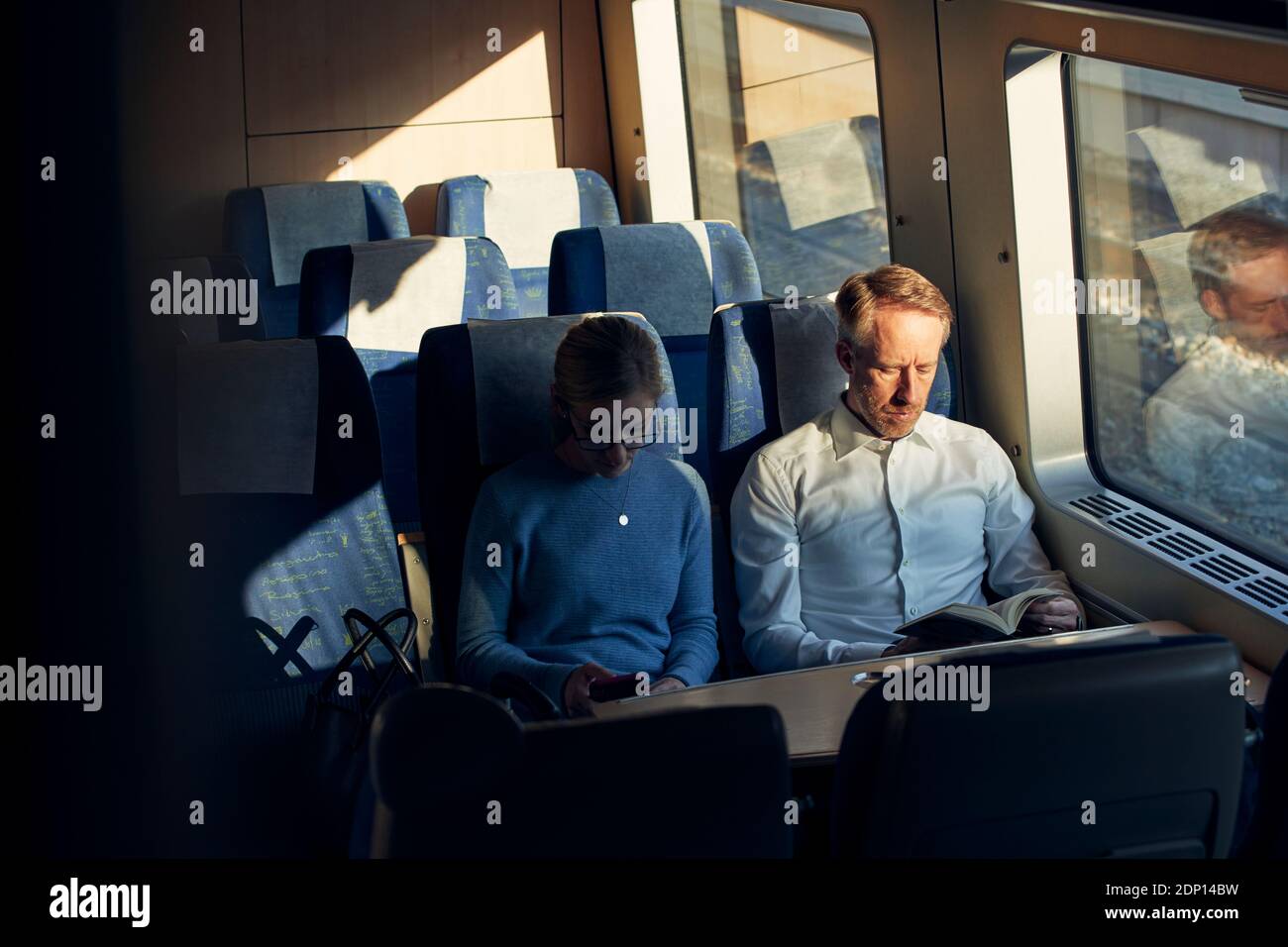 Couple in train carriage Stock Photo - Alamy