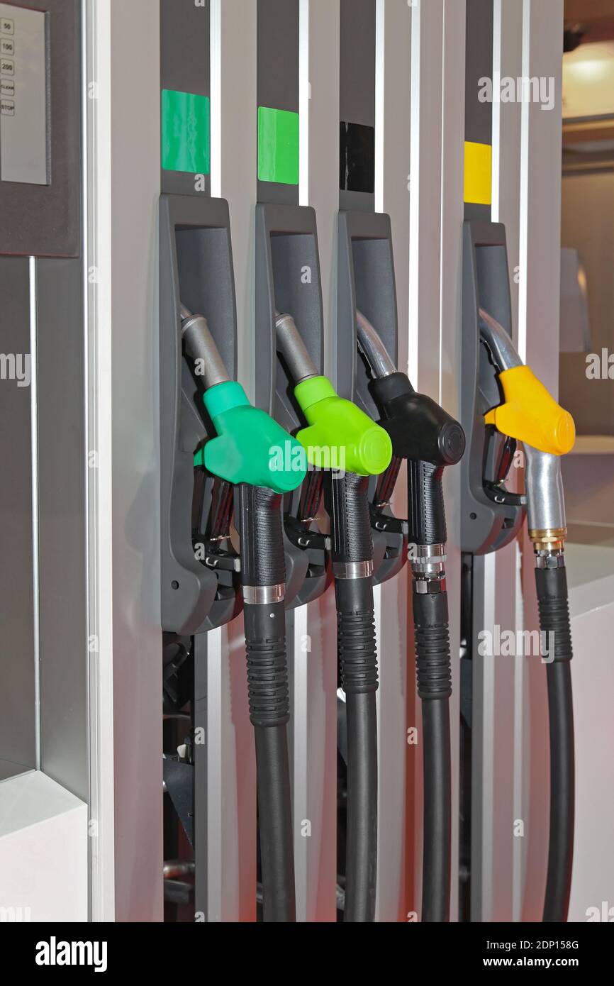 Color Coded Fuel Nozzles at Petrol Station Stock Photo - Alamy