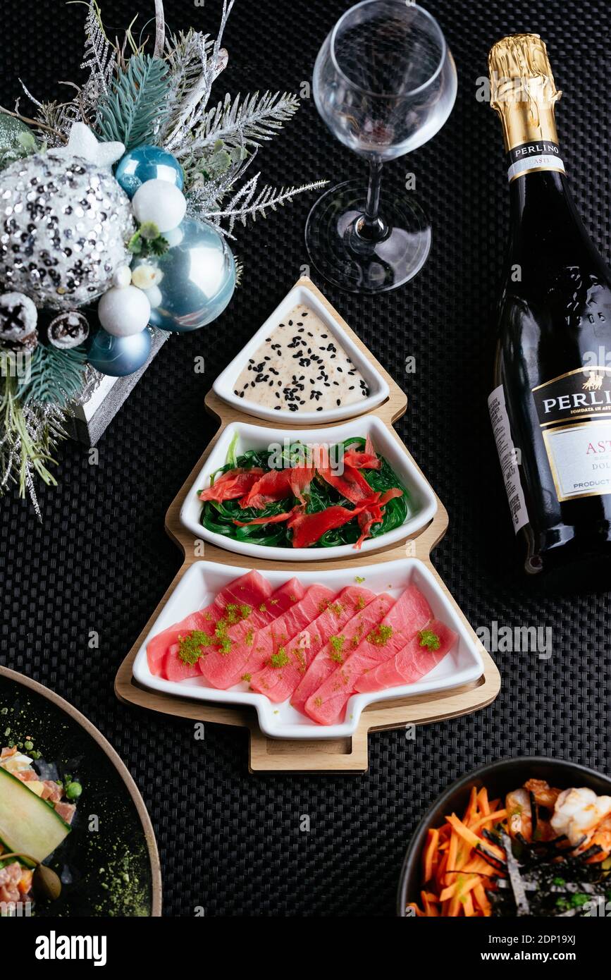 fish appetizers in a plate in the shape of a christmas tree on the new ...