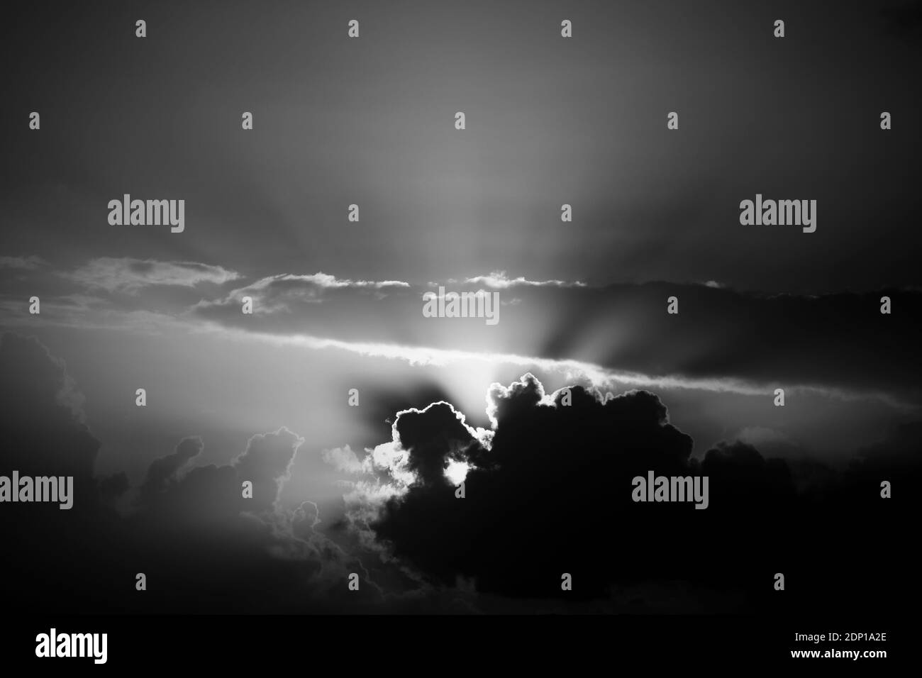 Sun rays through storm clouds Black and White Stock Photos & Images - Alamy