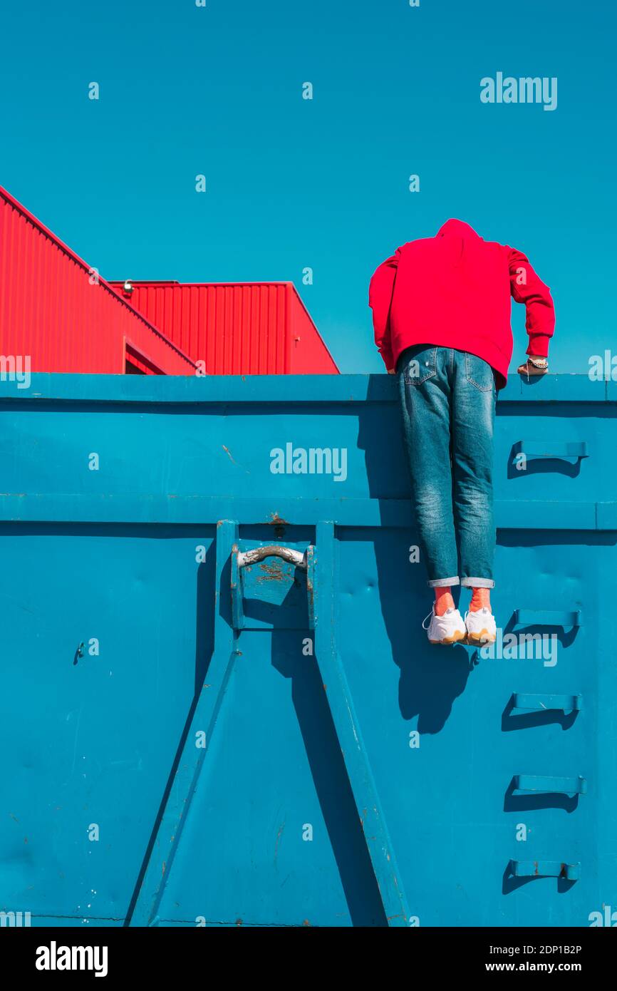 Young man pushing up hi-res stock photography and images - Alamy