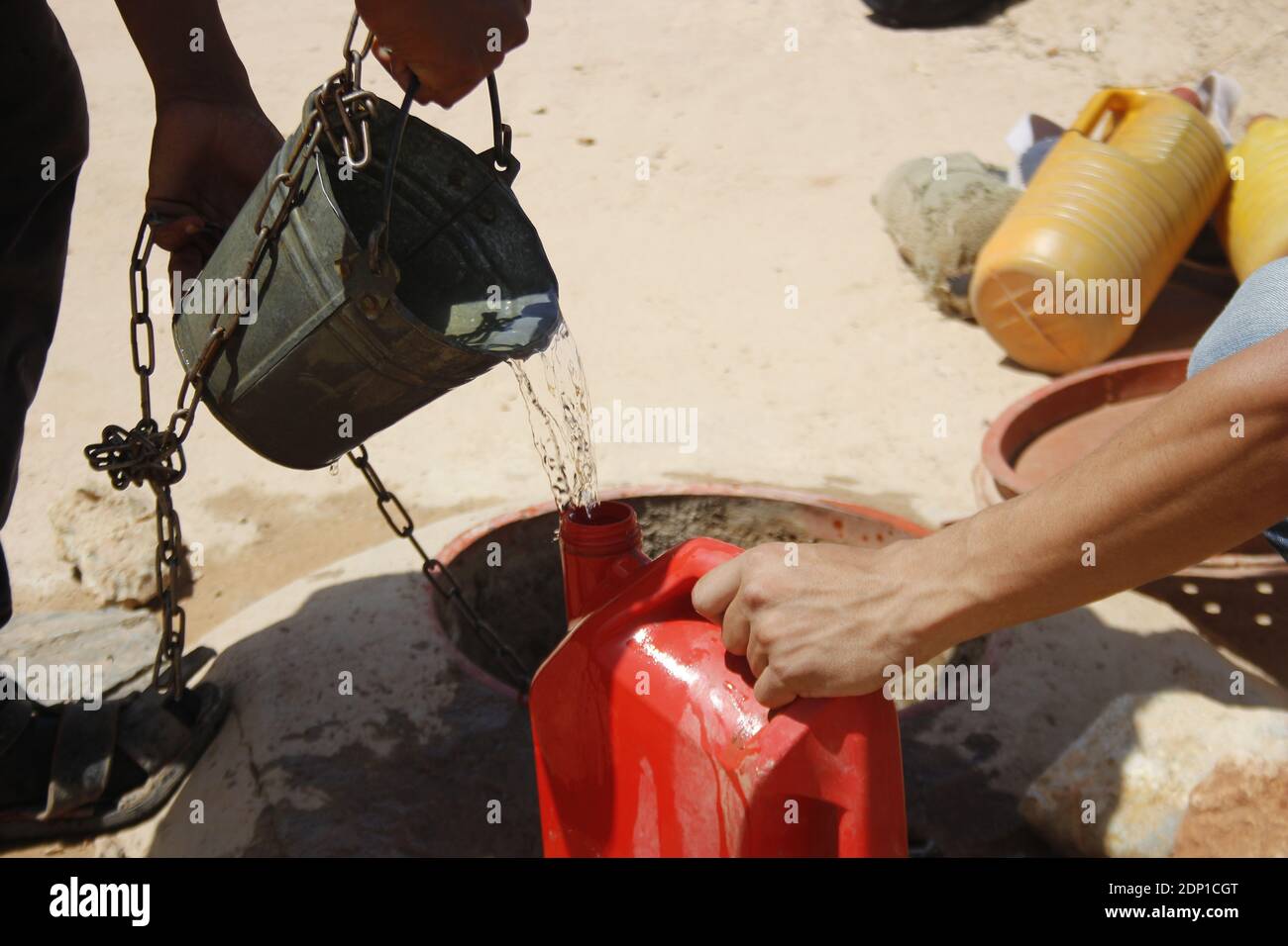 Pouring water bucket well hi-res stock photography and images - Alamy