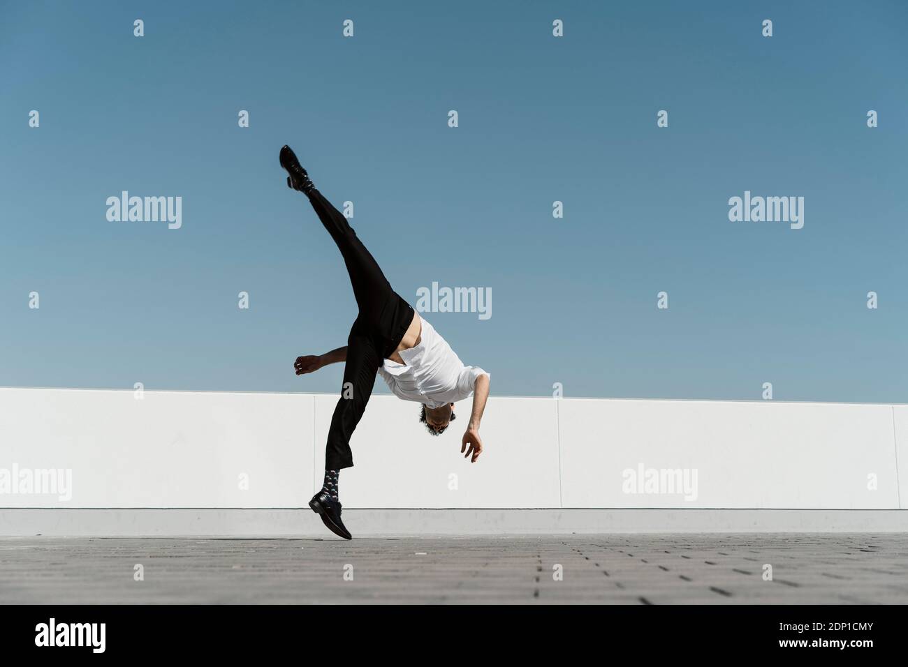 Artist practising on roof terrace Stock Photo - Alamy