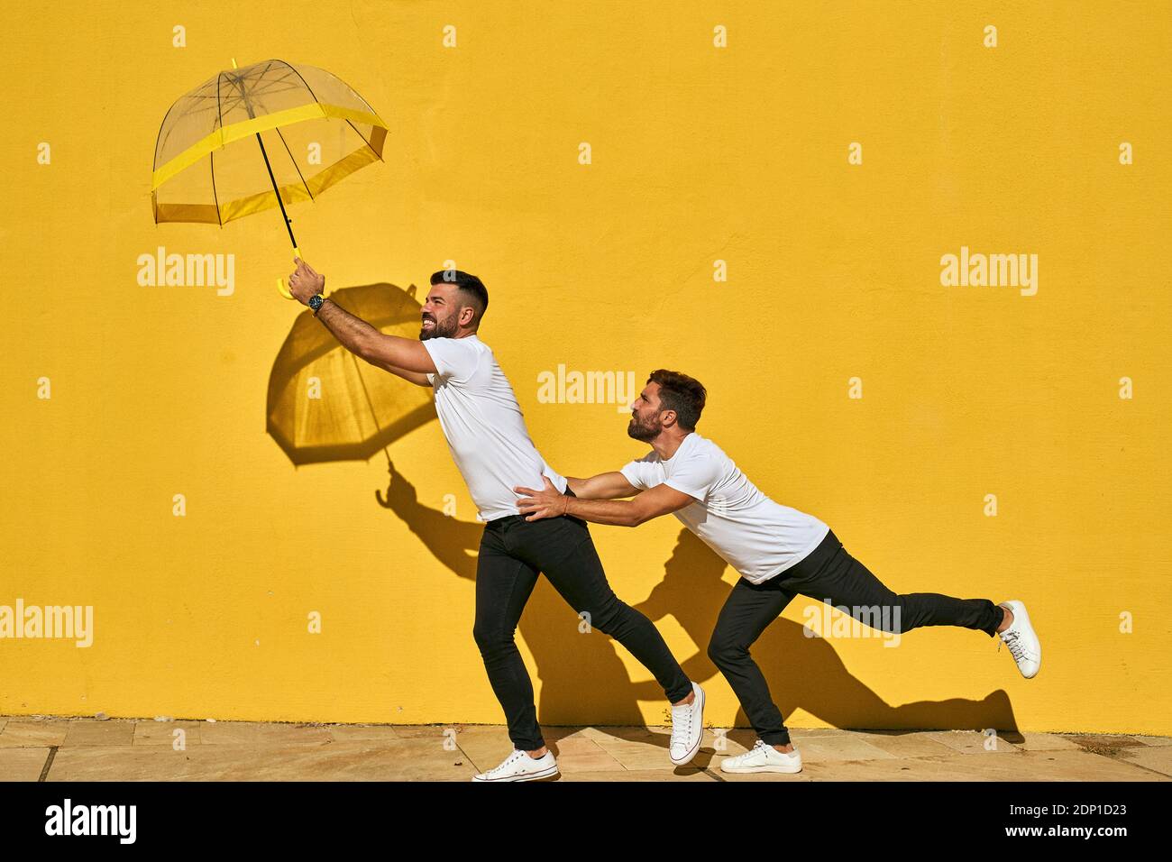 Standing against wind two people hi-res stock photography and images ...