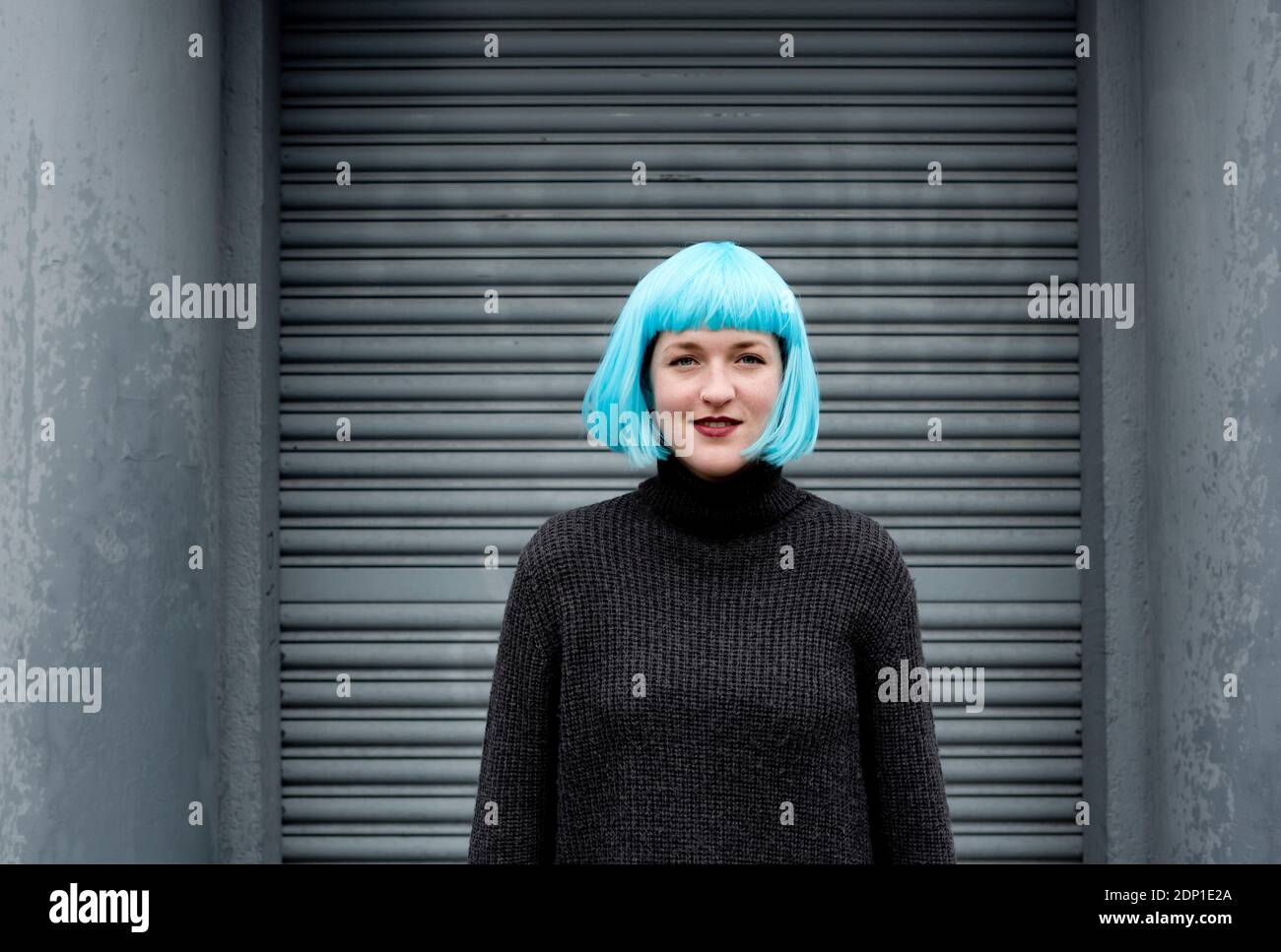Happy woman wearing blue turtleneck hi-res stock photography and images ...