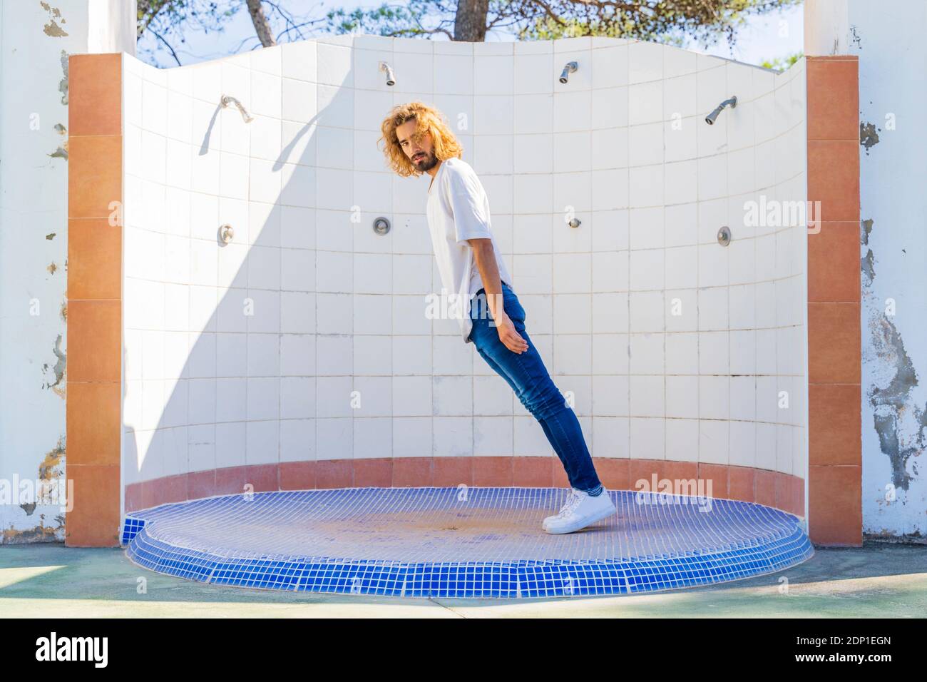 Portrait of young man standing slanted Stock Photo - Alamy